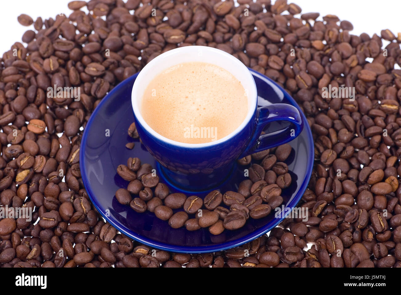 blue espresso cup in coffee beans sea Stock Photo - Alamy