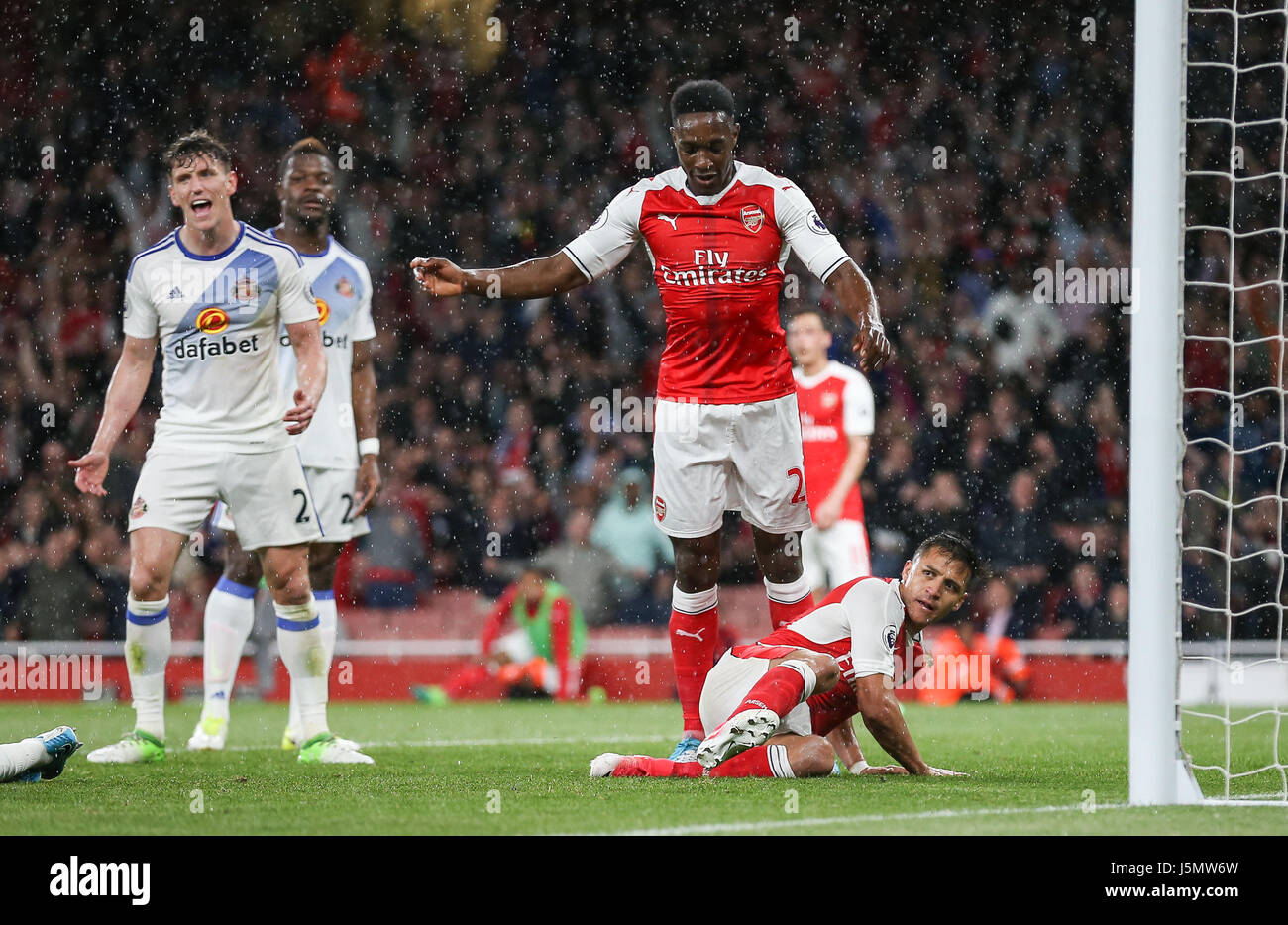 Alexis Sanchez of Arsenal looks at the linesman as he scores during the ...