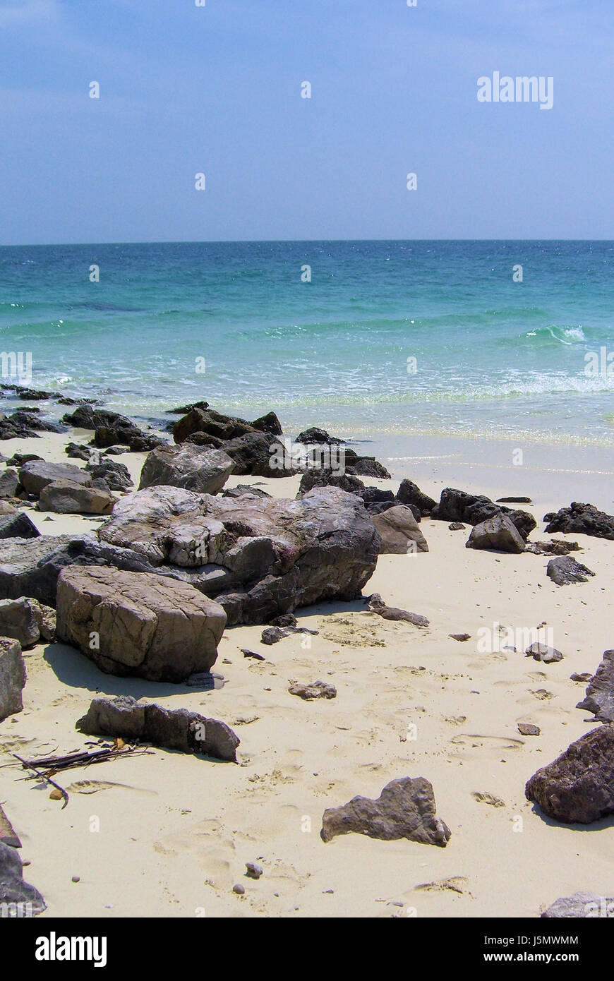 rocks sand beach Stock Photo - Alamy