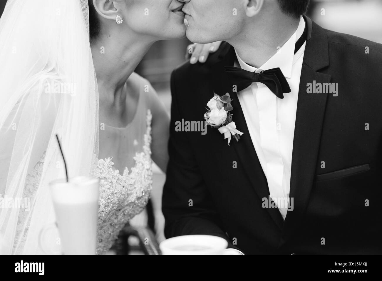 bride and groom standing in the cafe at the table Stock Photo - Alamy