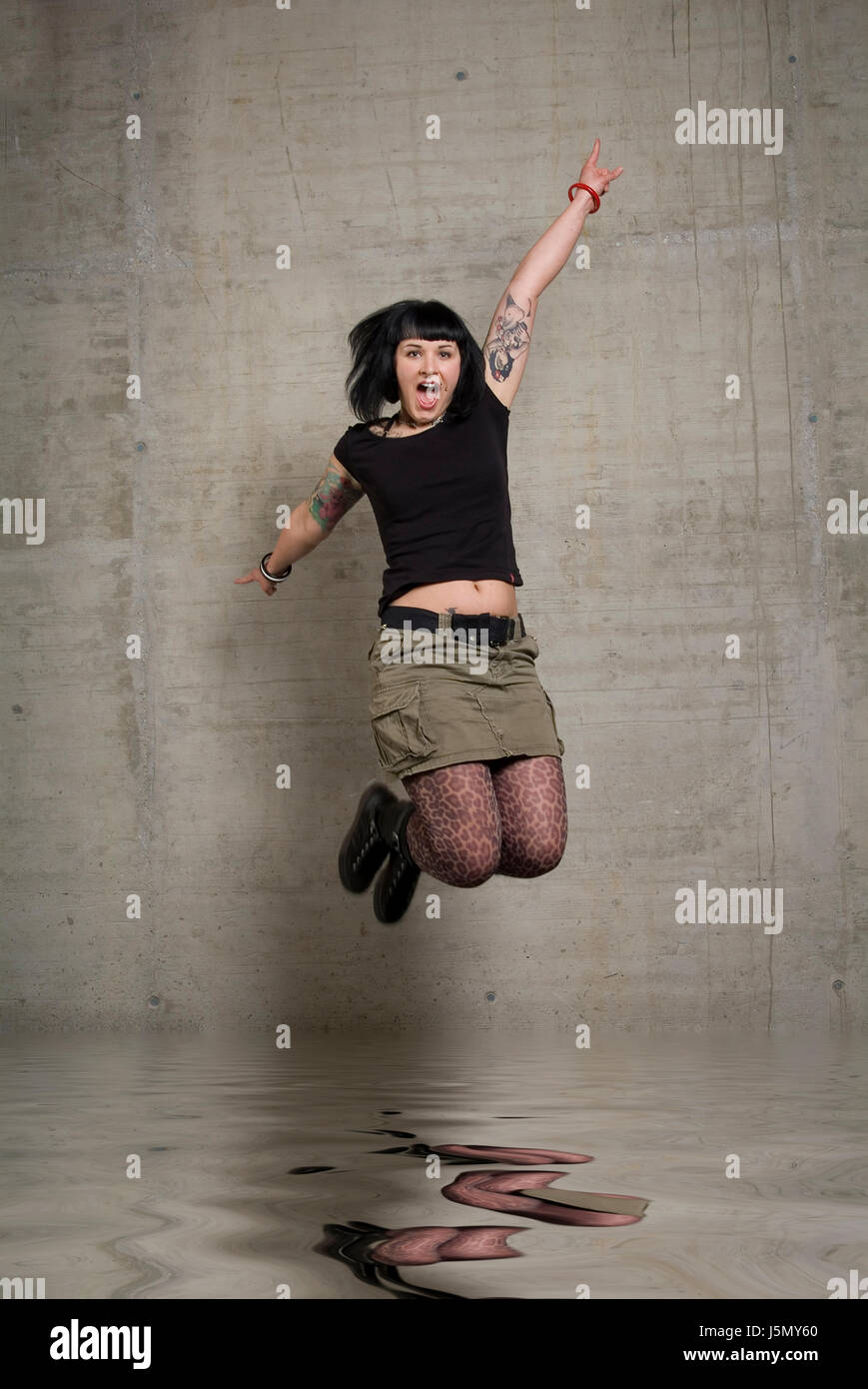 woman skirt lady concrete spring bouncing bounces hop skipping frisks ...