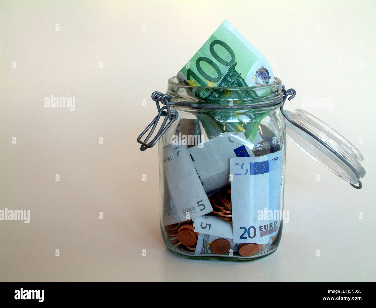 a jar full of money Stock Photo - Alamy