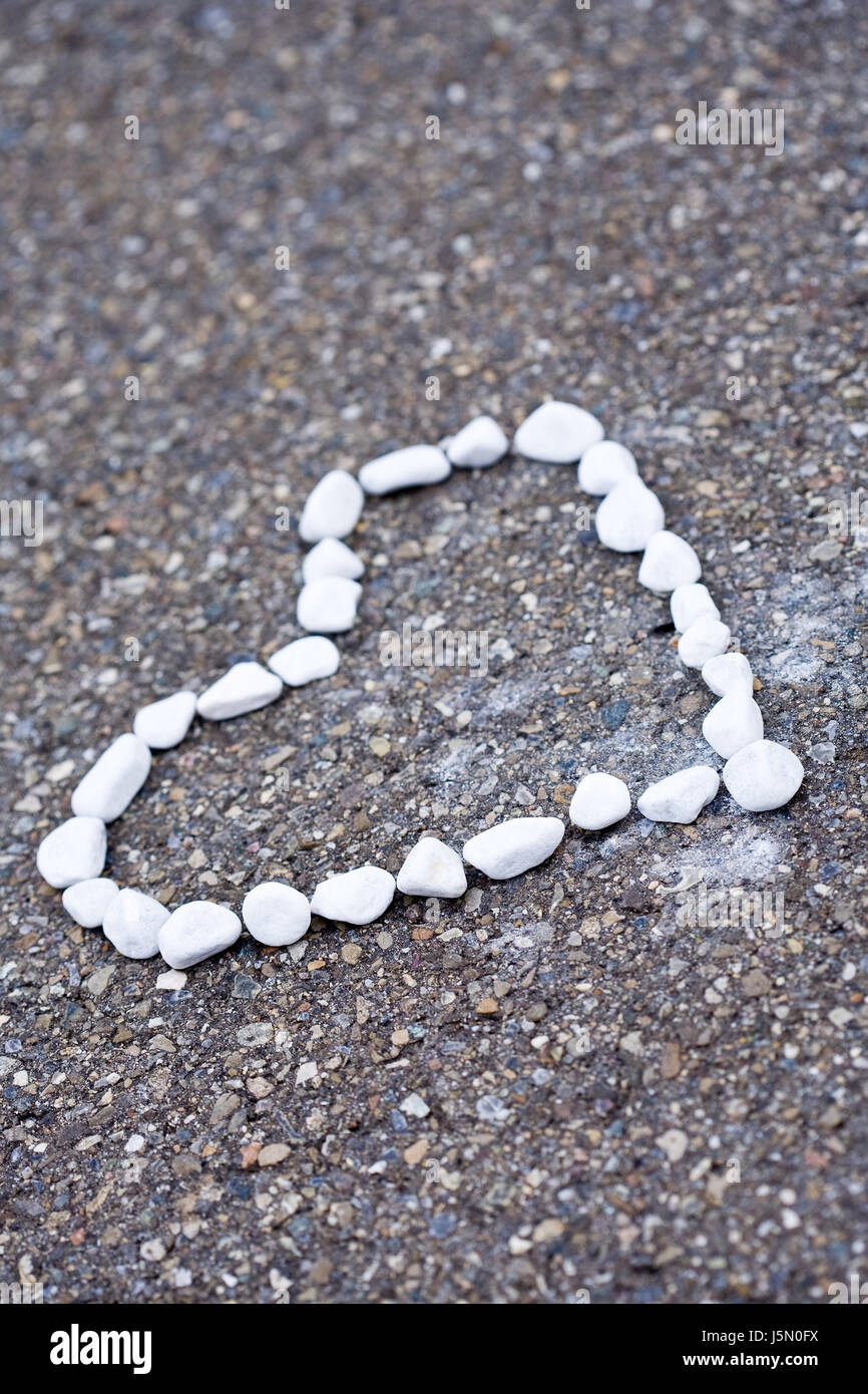 asphalt oblique pebbles love in love fell in love heart stones herzchen ...