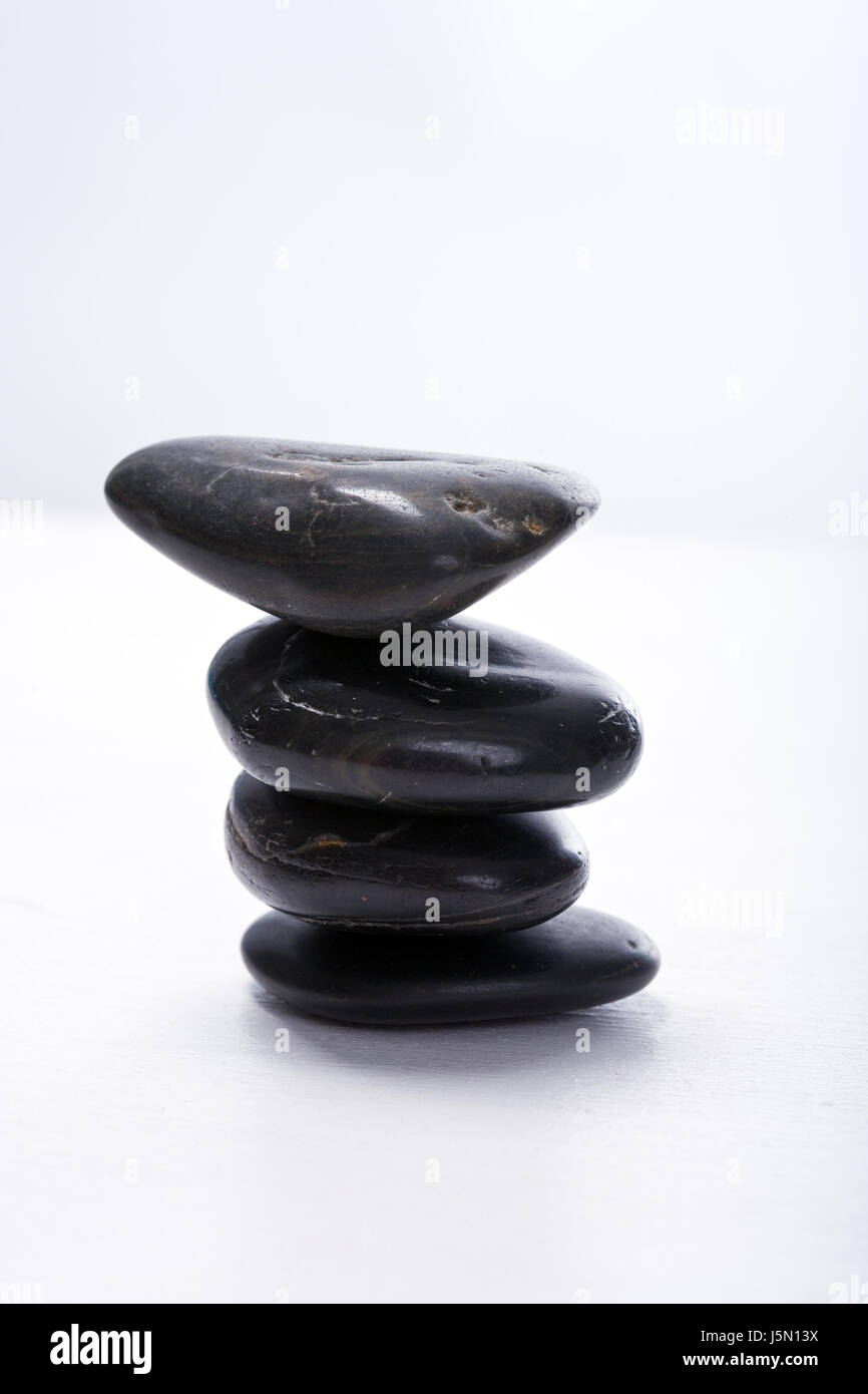 four stacked stones Stock Photo - Alamy