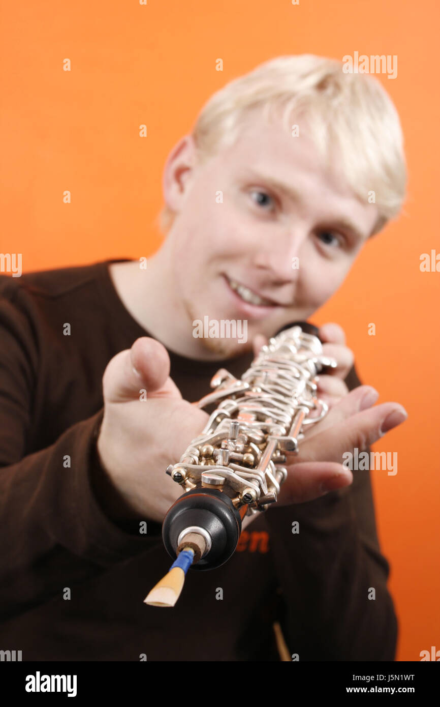 hand musical instrument brown brownish brunette male masculine face ...