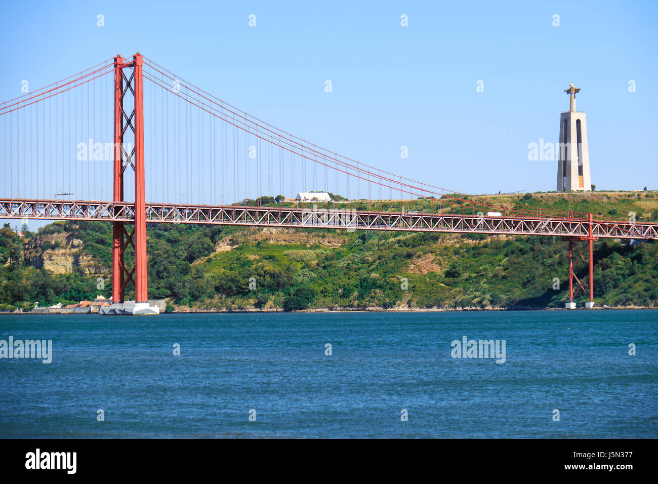 25th of April Bridge suspension bridge over river Tejo with Jesus ...