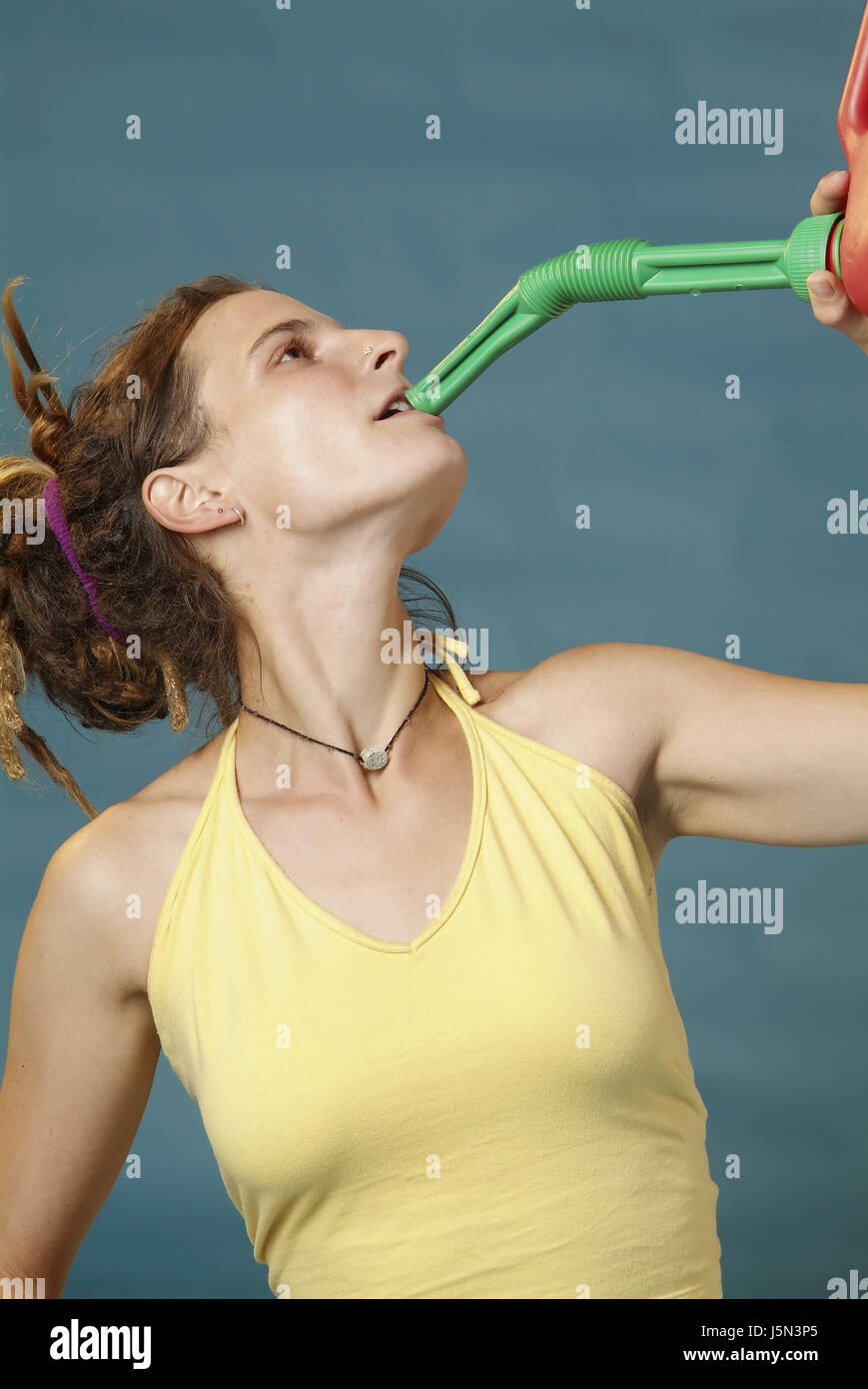 woman drinking from cans Stock Photo - Alamy