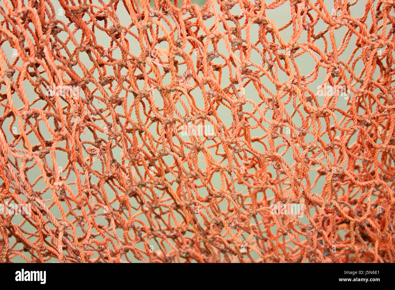 A close shot of fishing net as a background Stock Photo - Alamy