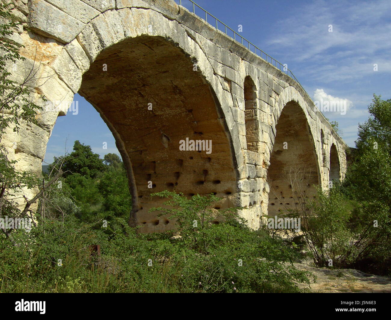 stone antique bridge arc france Provence roman seared arcs river water ...