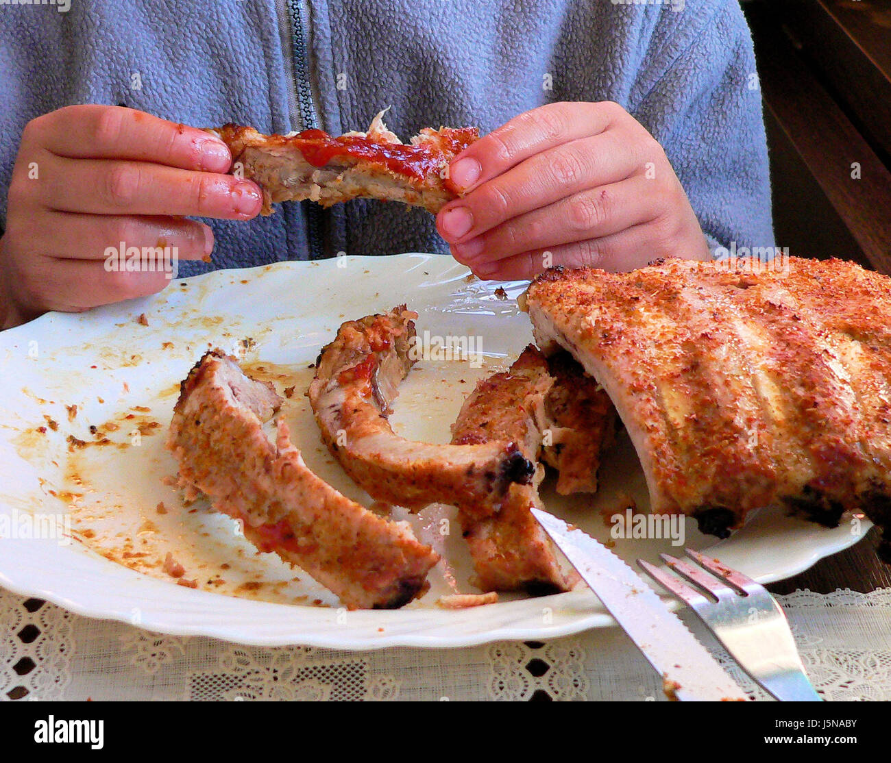 restaurant hand hands plate bone fork gnaw eating eat eats arm weapon ...