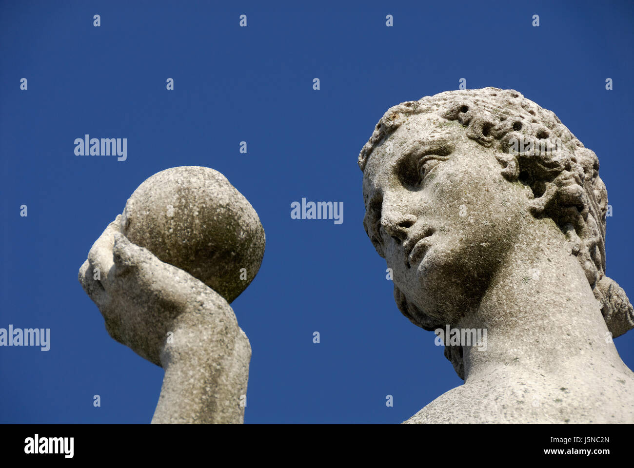 a statue is in love with his apple Stock Photo - Alamy
