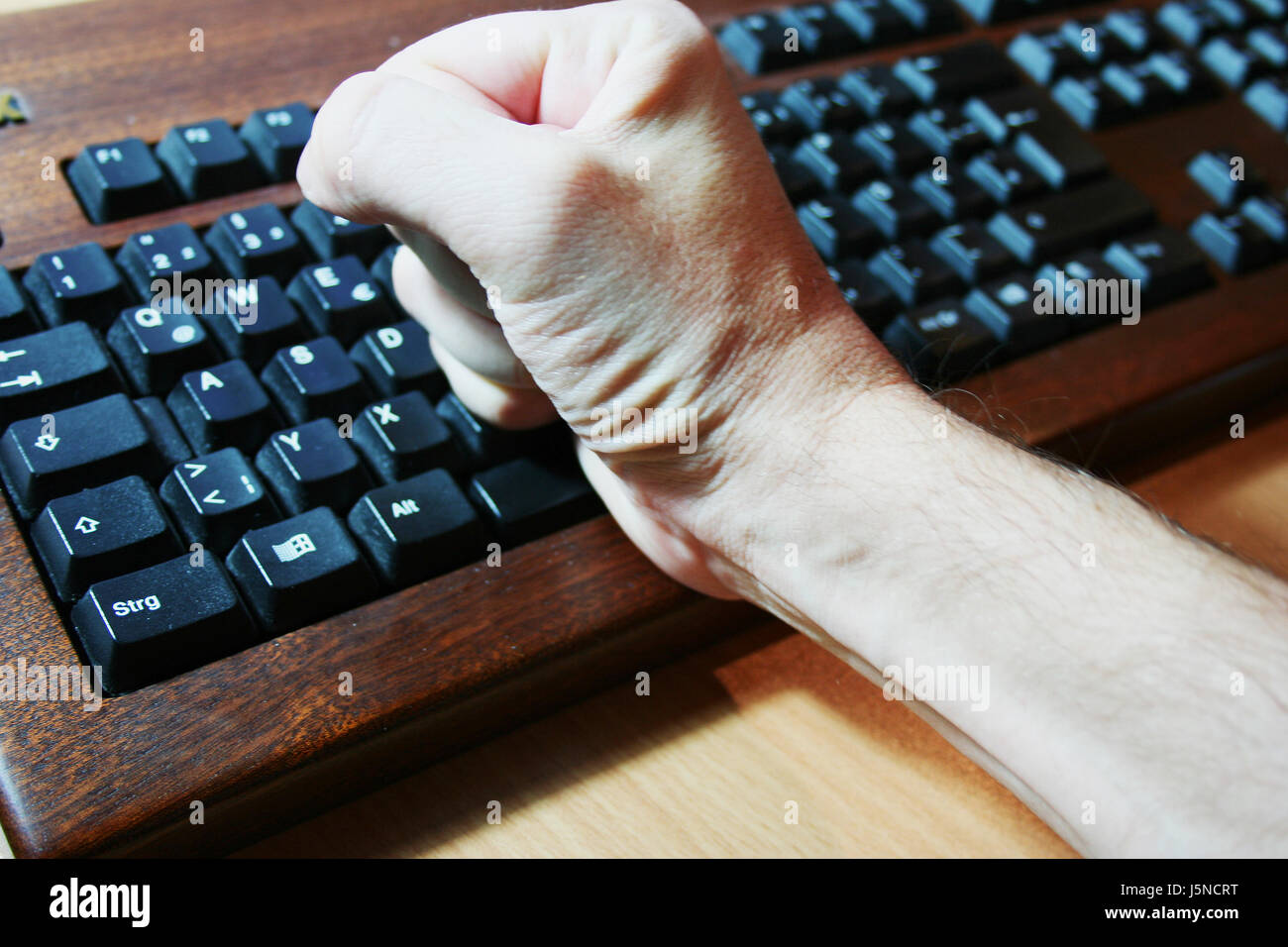 fist on keyboard Stock Photo - Alamy