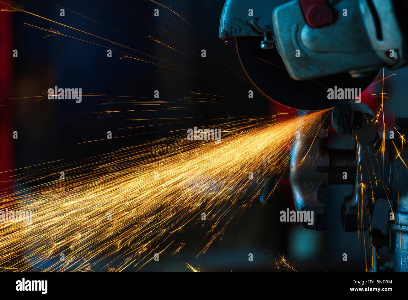 Angular grinding machine is cutting the metal and a lot of sparks ...