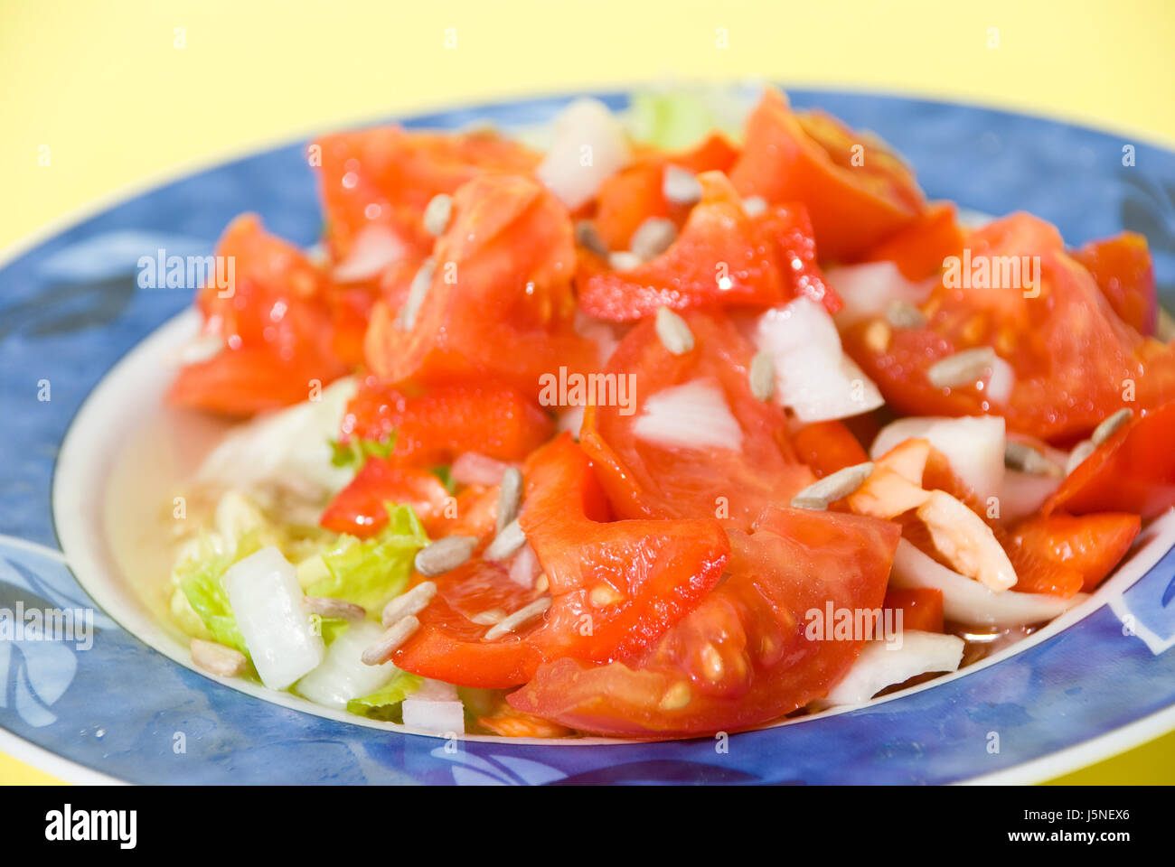 tomato salad with sunflower seeds 3 Stock Photo - Alamy