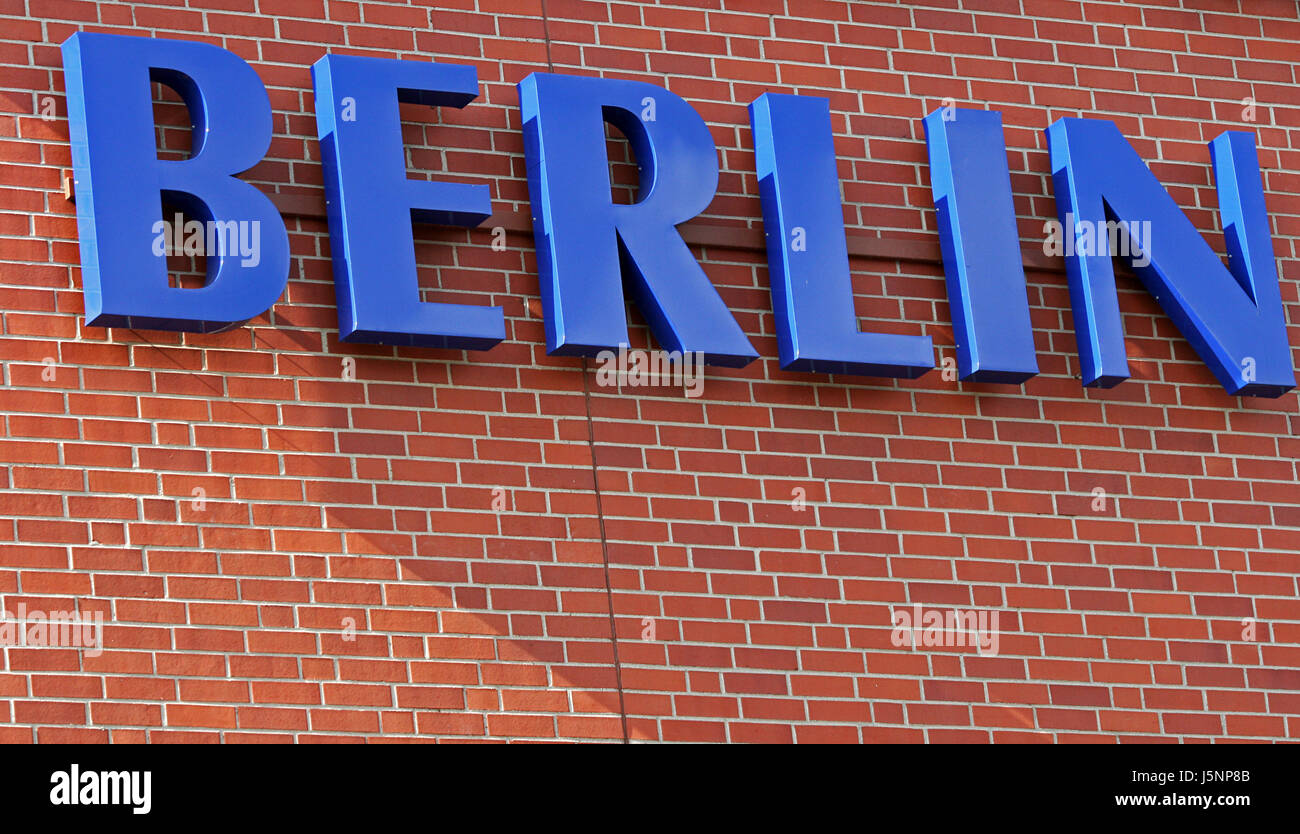 blue stone emblem sunlight wall berlin letters word metal bracket ...