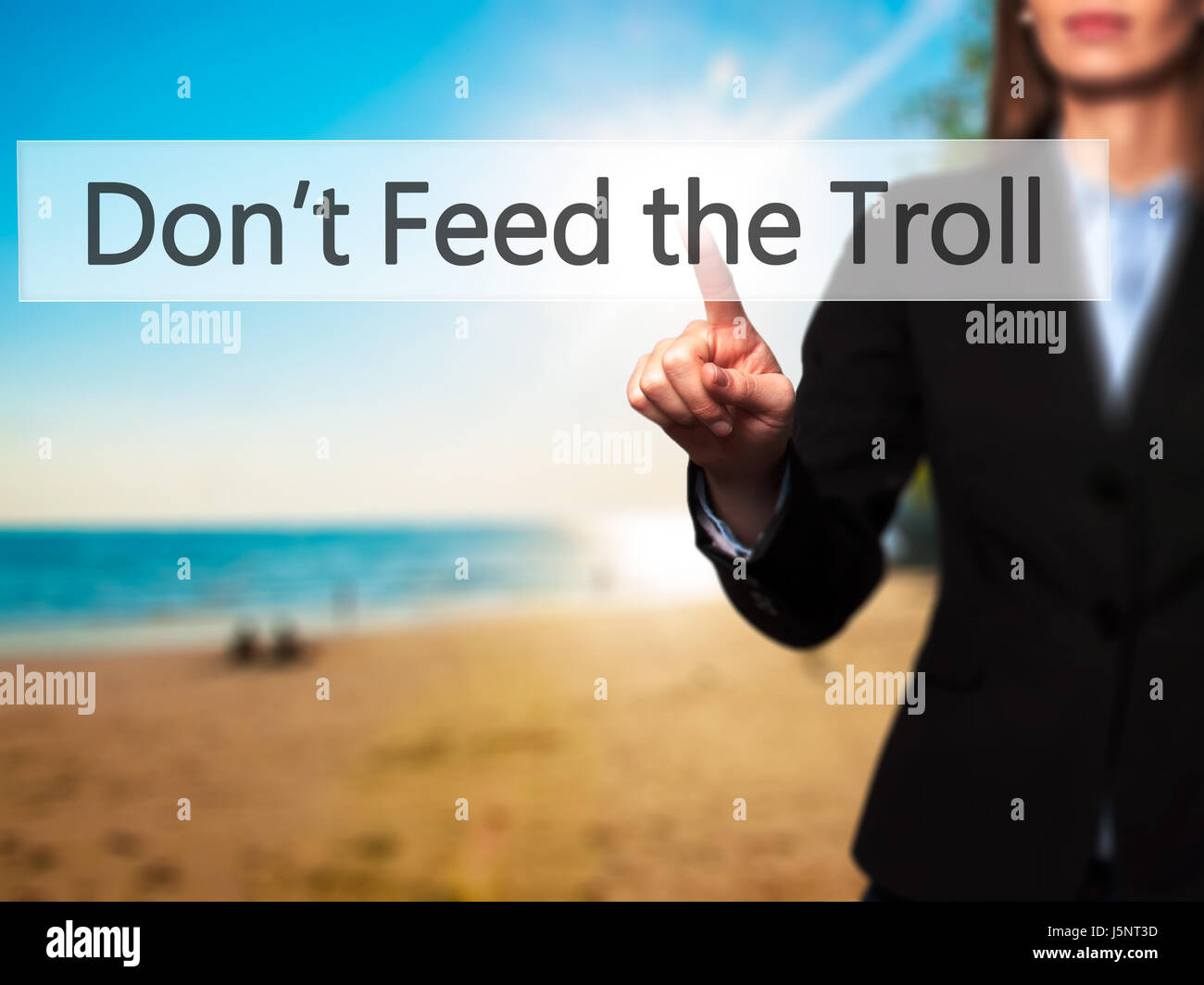 Don't Feed the Troll - Businesswoman hand pressing button on touch ...