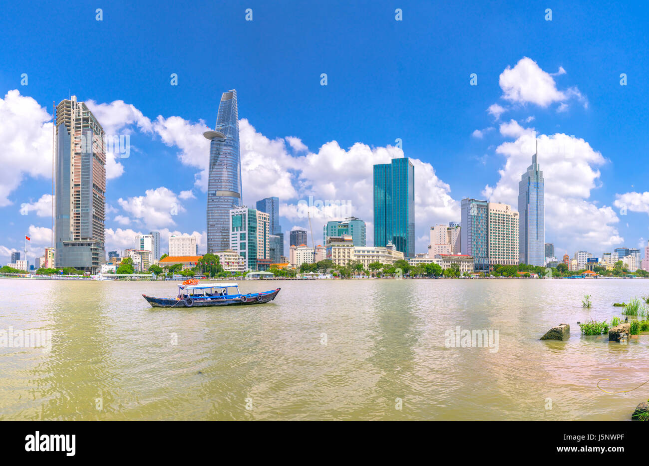Skyscrapers along river with architecture office towers, hotels, center ...