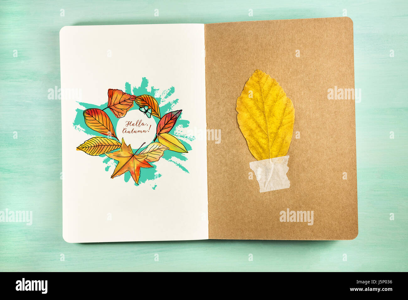 Notebook with taped autumn leaf and watercolor drawings Stock Photo - Alamy