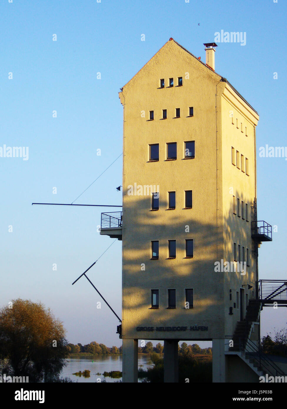 tower tree trees evening harbor plant harbours load vertical silo ...