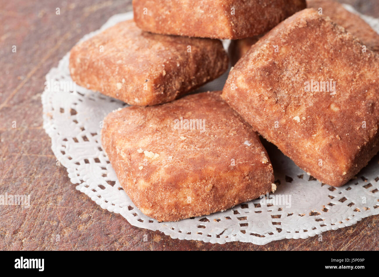 Pastry spisy on a timber board, close up Stock Photo - Alamy