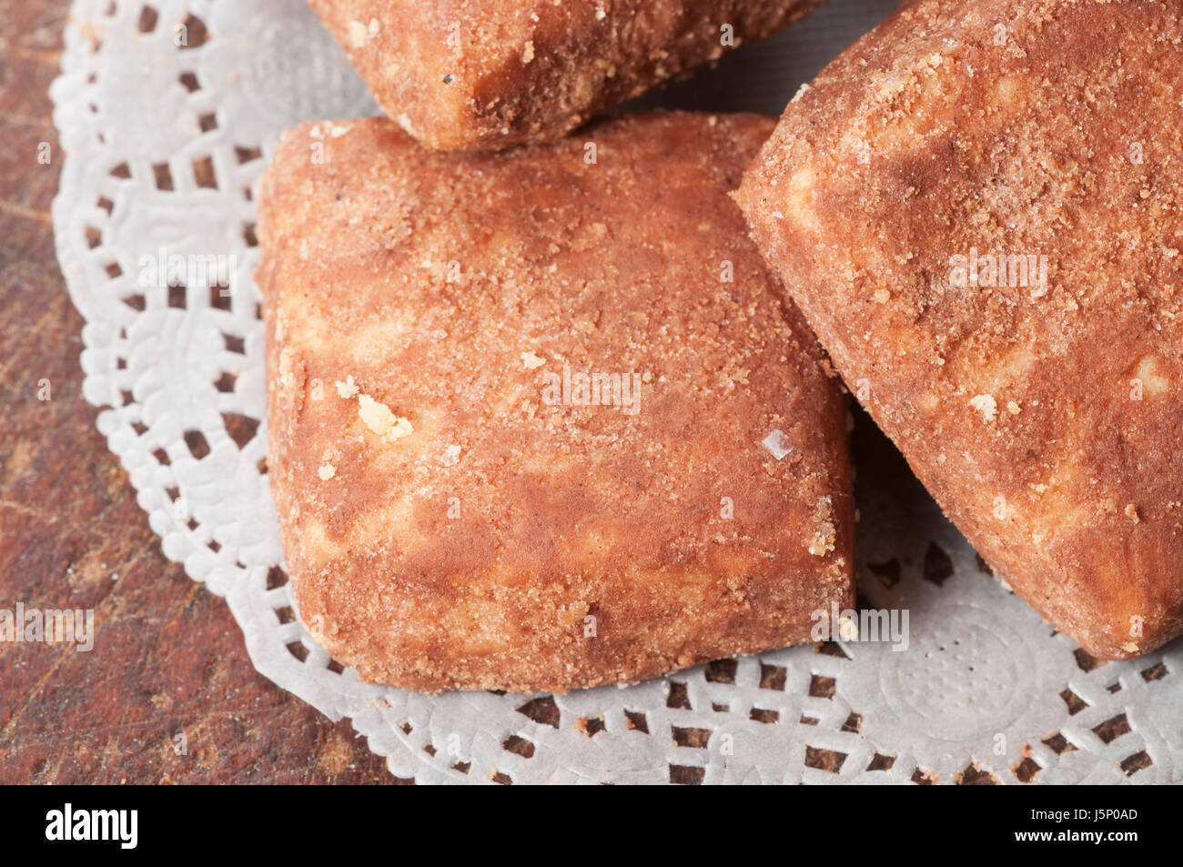 Pastry spisy on a timber board, close up Stock Photo - Alamy