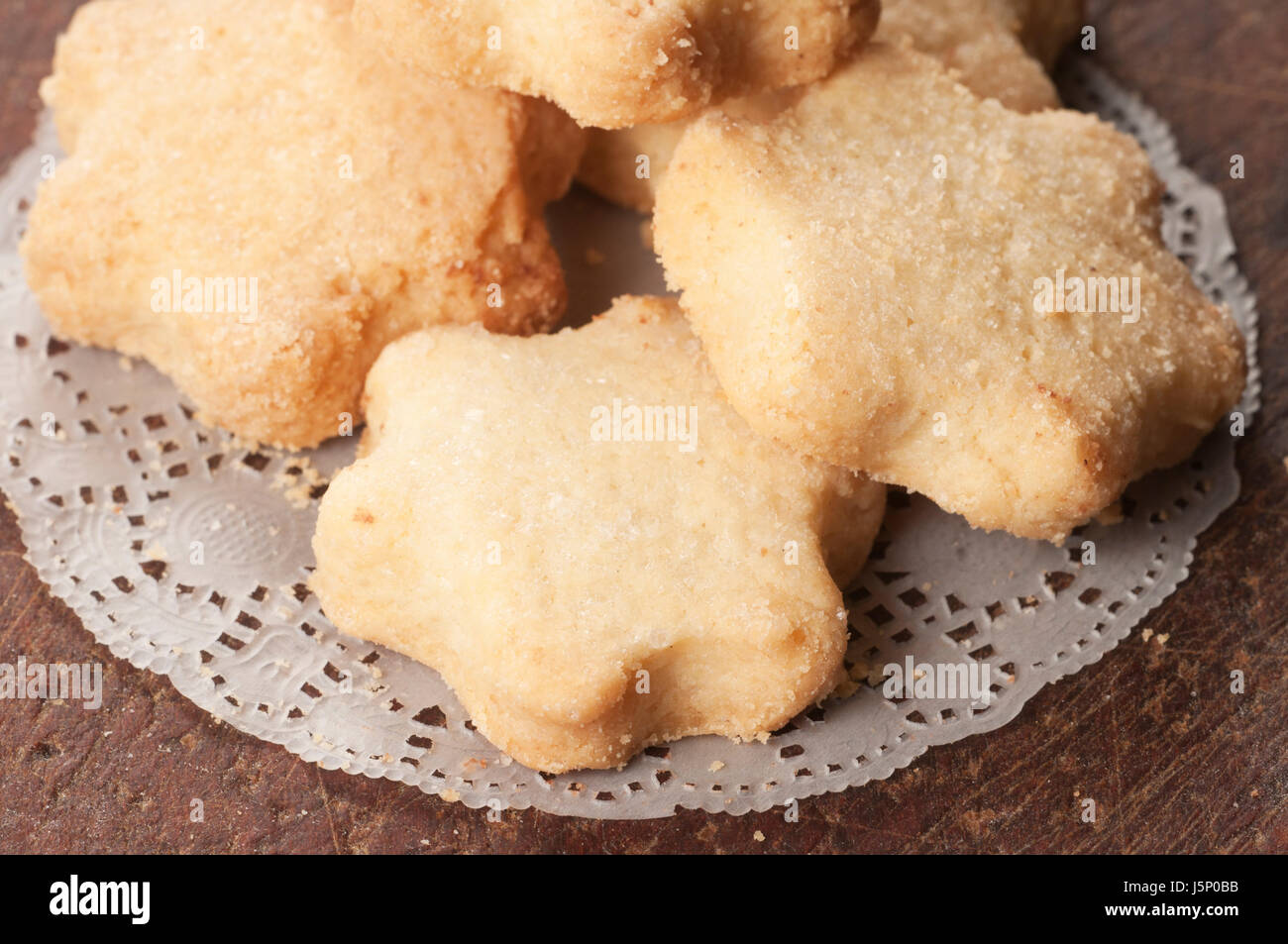 Sugar rose pastry on a timber board, close up Stock Photo - Alamy