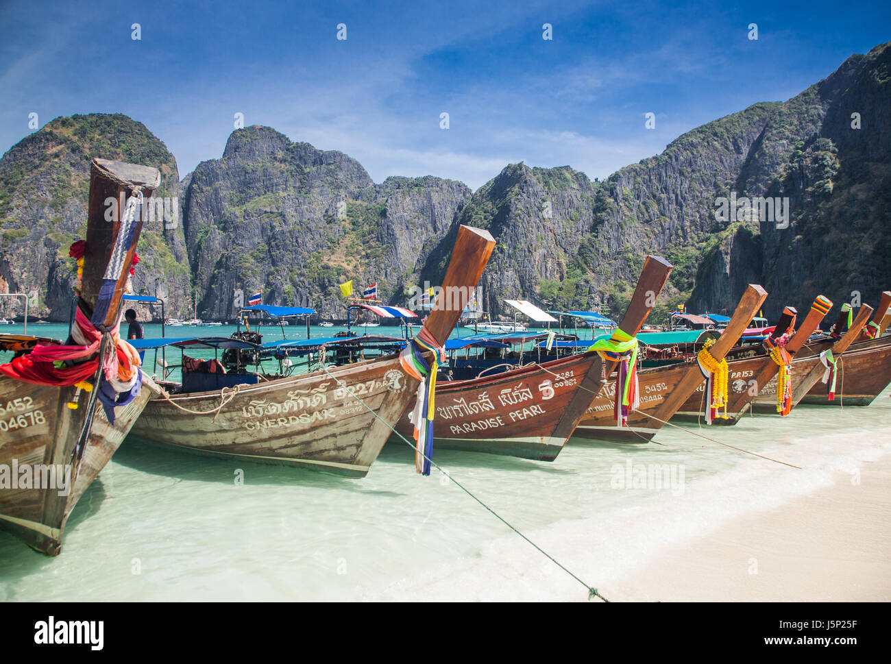 KO PHI PHI, THAILAND, February 1, 2014: Traditional long tail boats on ...