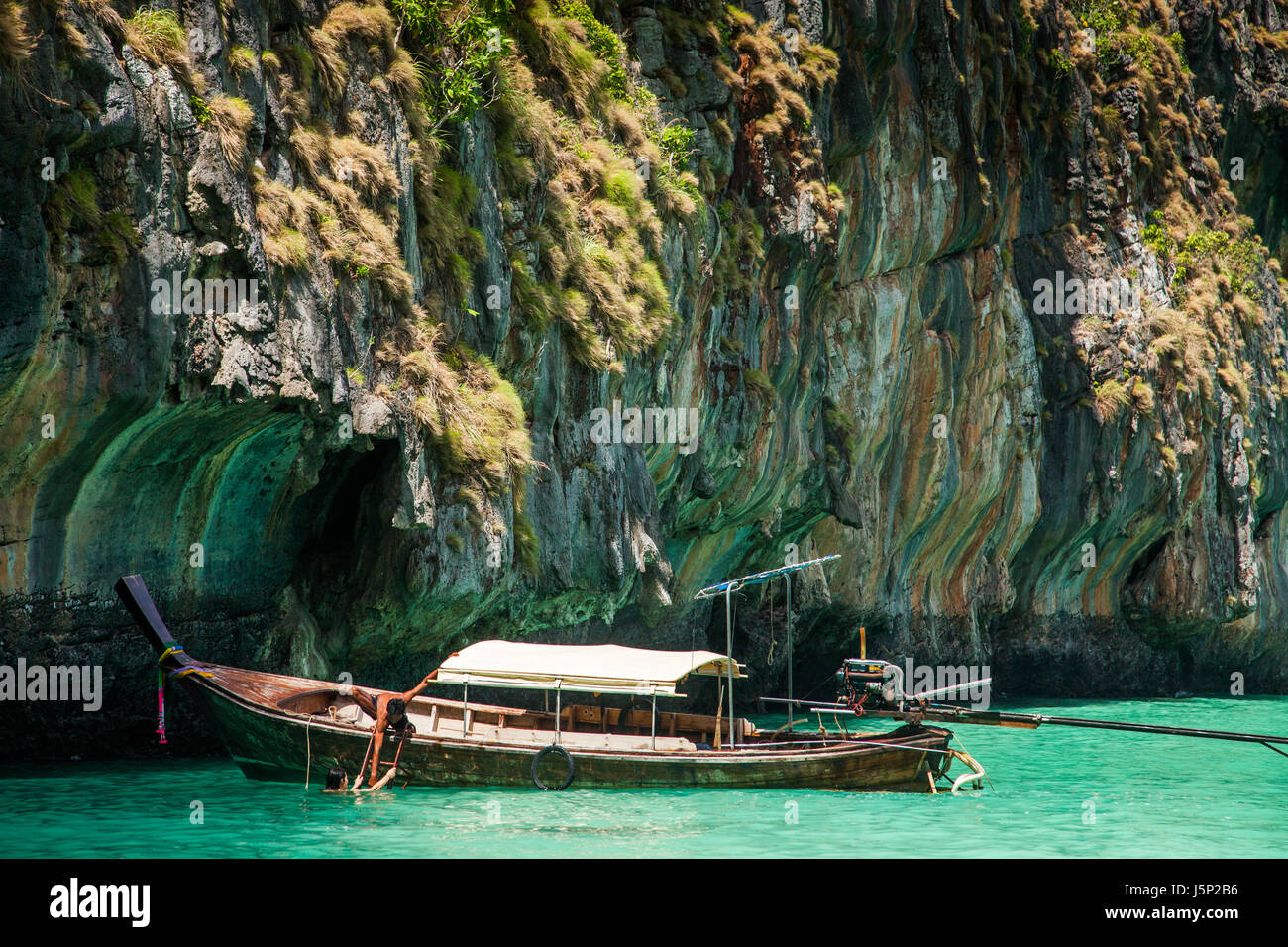 KO PHI PHI, THAILAND, February 1, 2014: Traditional long tail boats on ...
