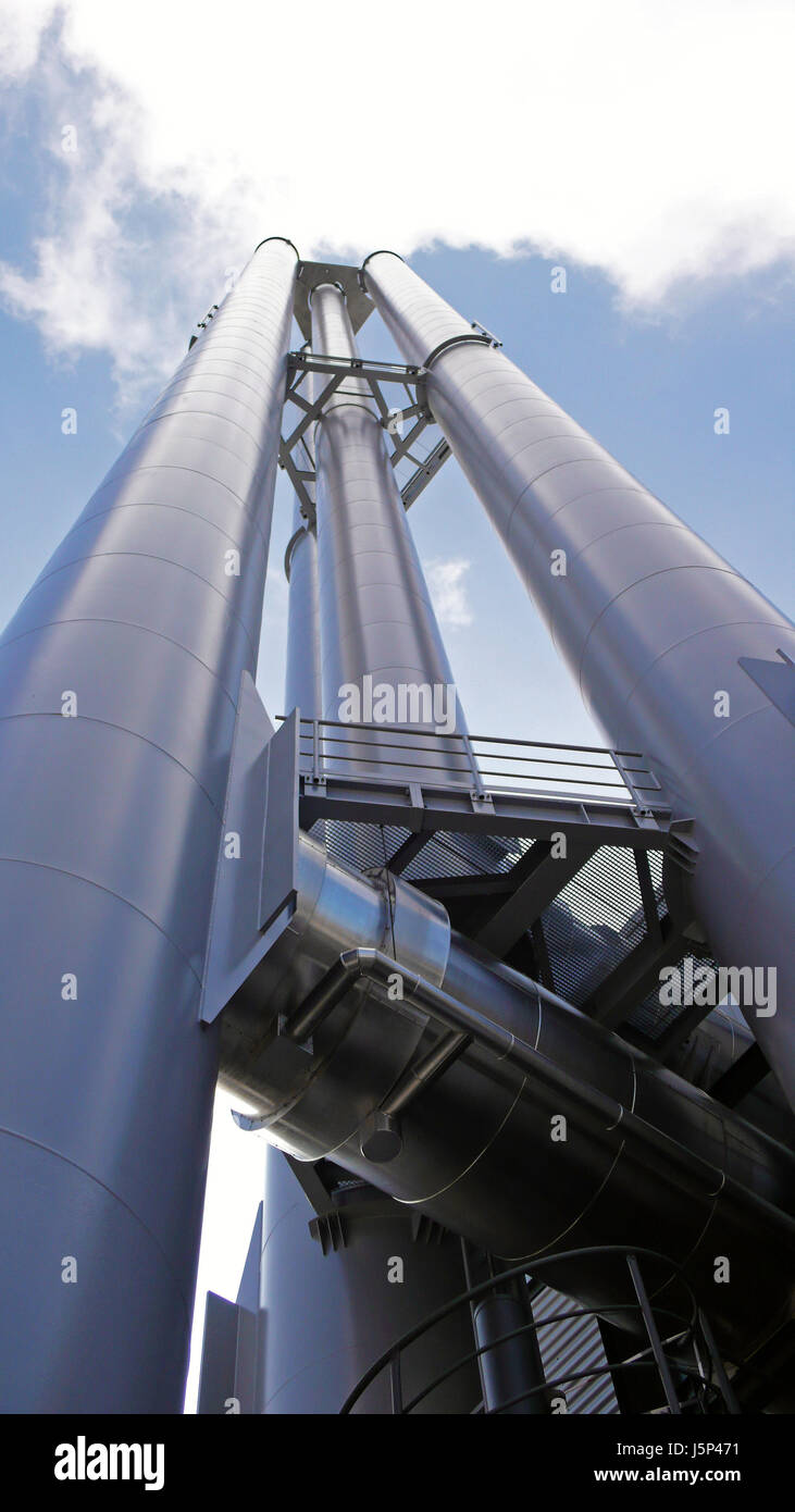 blue power station industrial plant steel three bright shiny tube ...