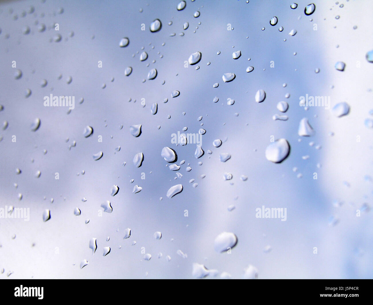 blue window porthole dormer window pane cold raindrop thunderstorm ...
