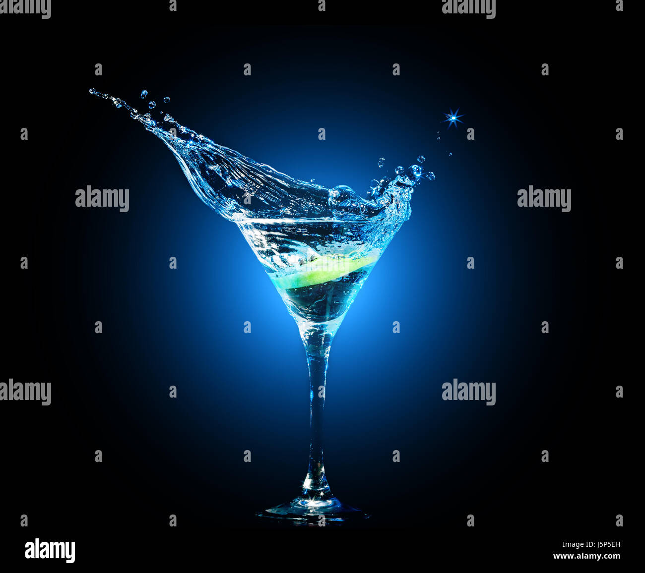 cocktail in glass with splashes Stock Photo - Alamy