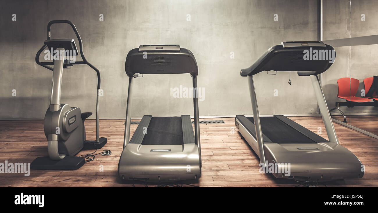 Treadmills exercise machines Stock Photo - Alamy