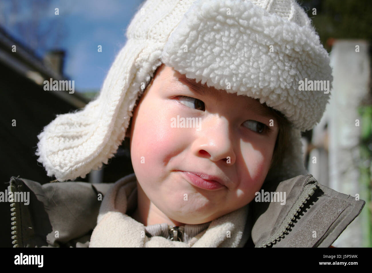winter cold male masculine face portrait cap scarf irritated boy lad ...
