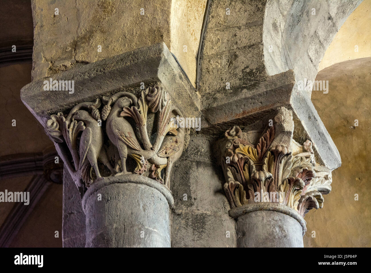 Mozac. Capitals of Saint-Pierre Abbey Church outdoors. Puy de Dome ...