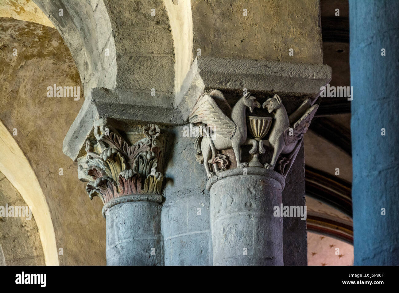 Mozac. Capitals of Saint-Pierre Abbey Church outdoors. Puy de Dome ...
