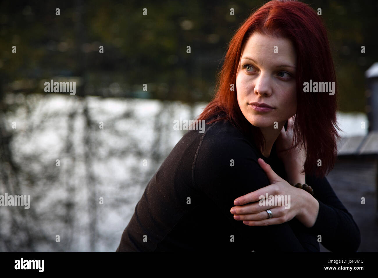 woman hand face portrait sad hairs put sitting sit red water fall ...
