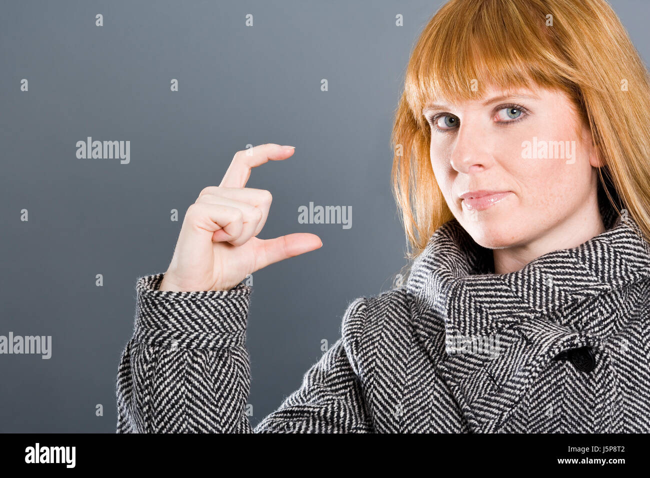 woman indicate show finger symbolic small tiny little short distance ...