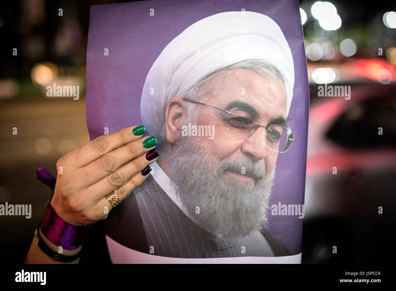 Tehran, Iran. 18th May, 2017. A supporter holds a poster of Iranian ...