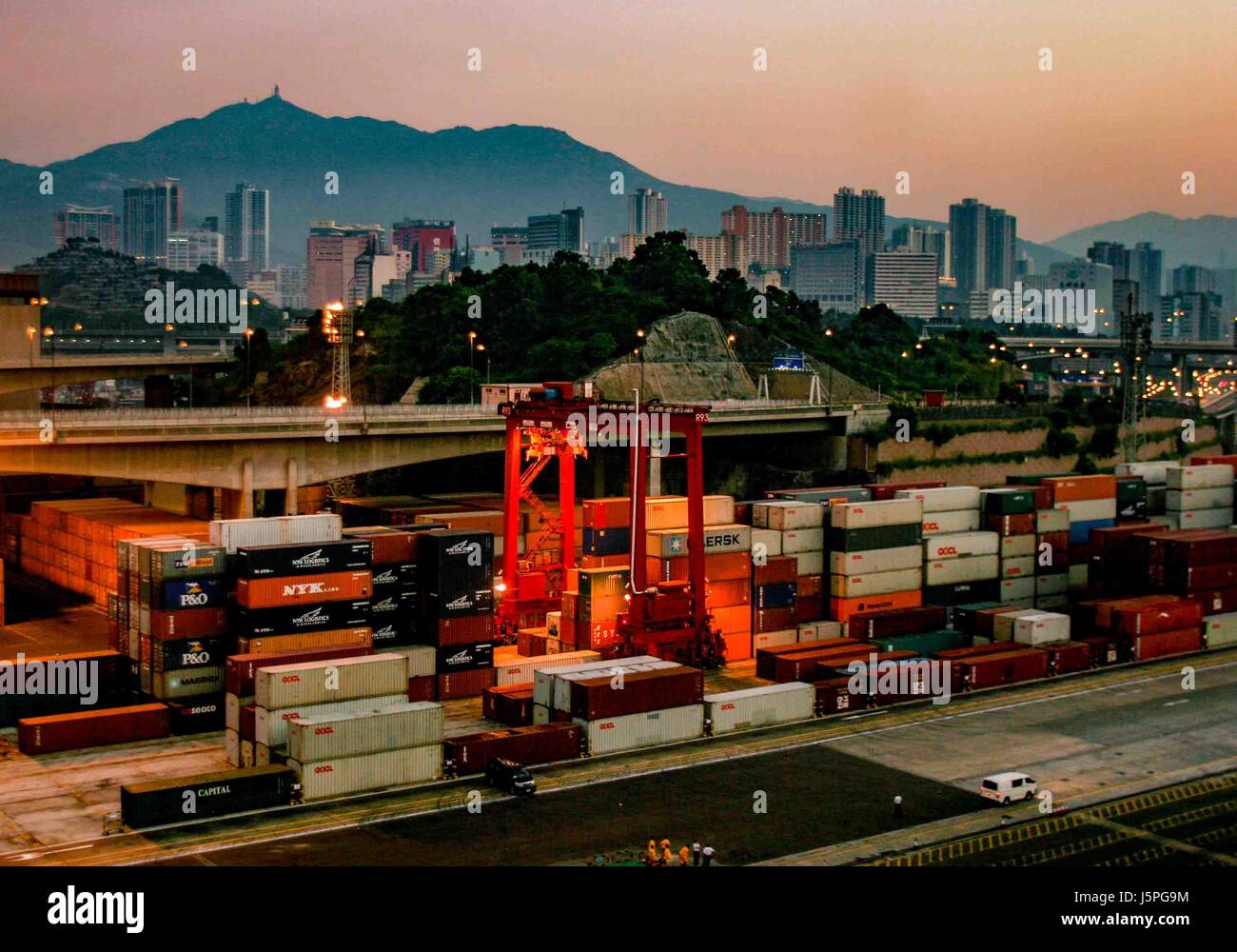 Hong Kong, China. 4th Nov, 2006. Shipping containers are stacked high ...