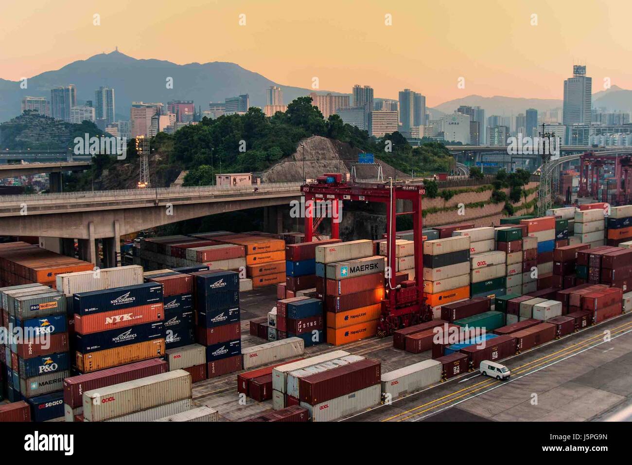Hong Kong, China. 4th Nov, 2006. Shipping containers are stacked high ...