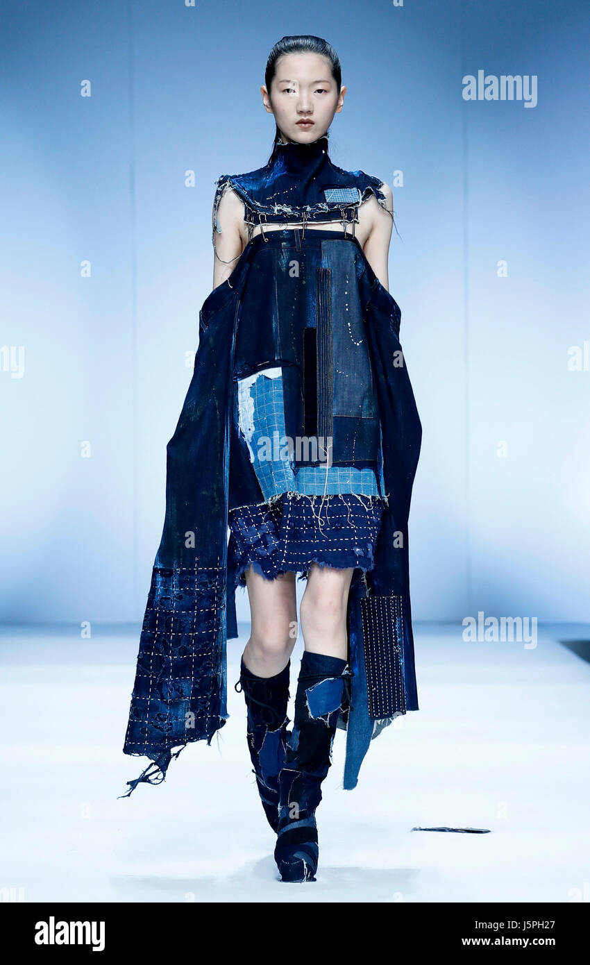 Beijing, China. 18th May, 2017. A model presents a fashion creation ...