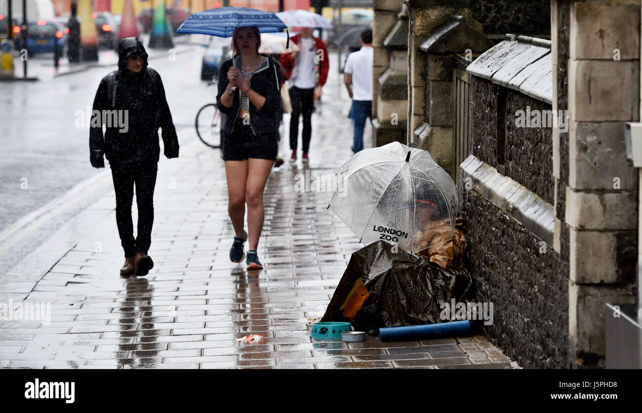 Homeless man in the rain hi-res stock photography and images - Alamy