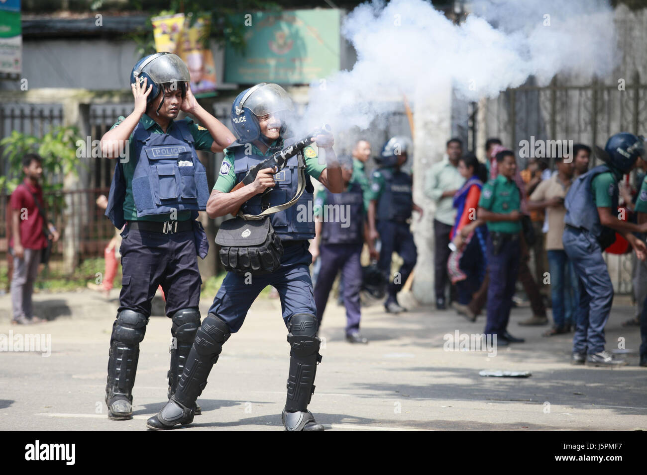 Dhaka, Bangladesh. 18th May, 2017. Bangladeshi police fire tear shell ...