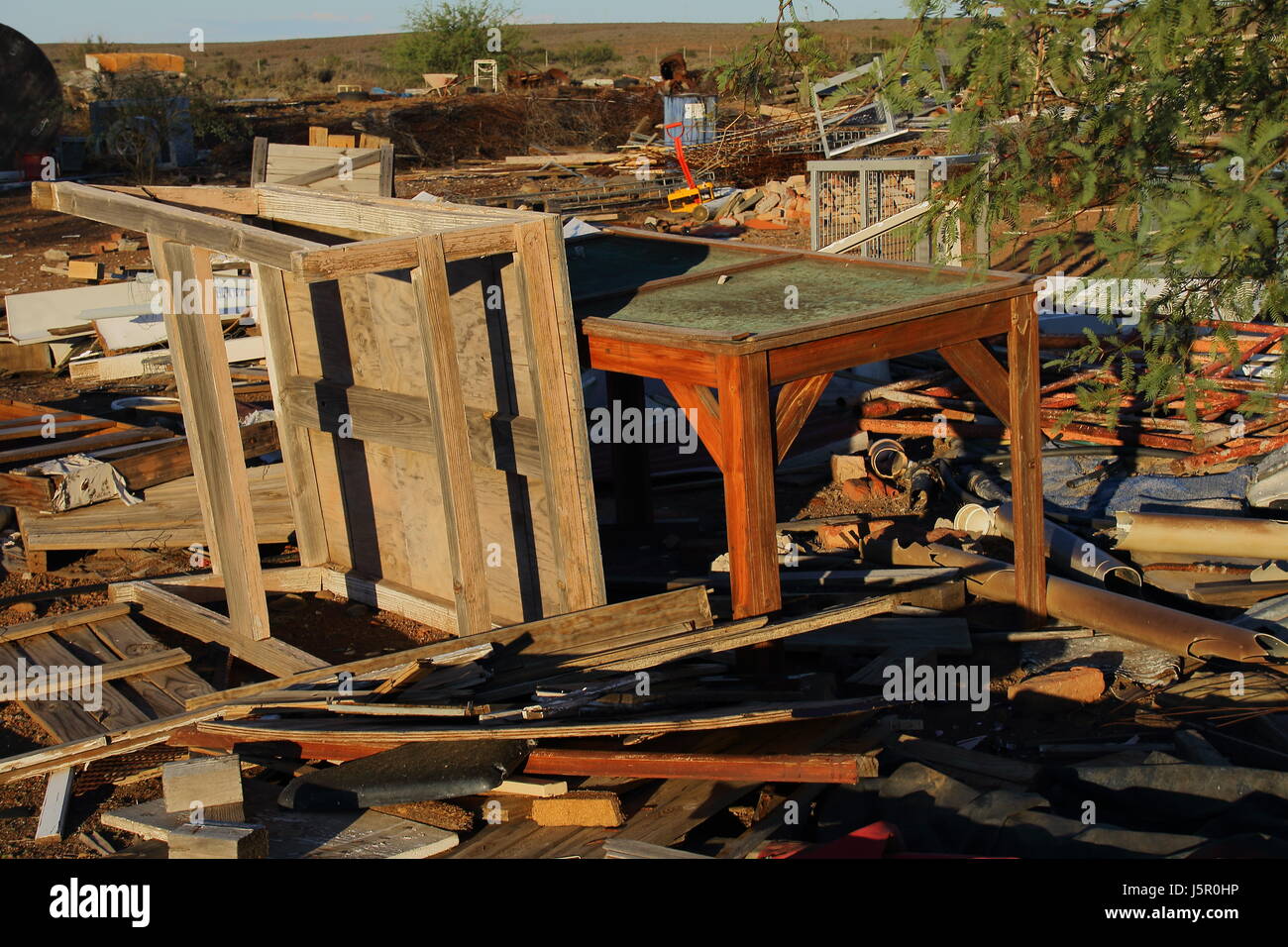 Rubble from a destroyed homestead litter the countryside Stock Photo ...
