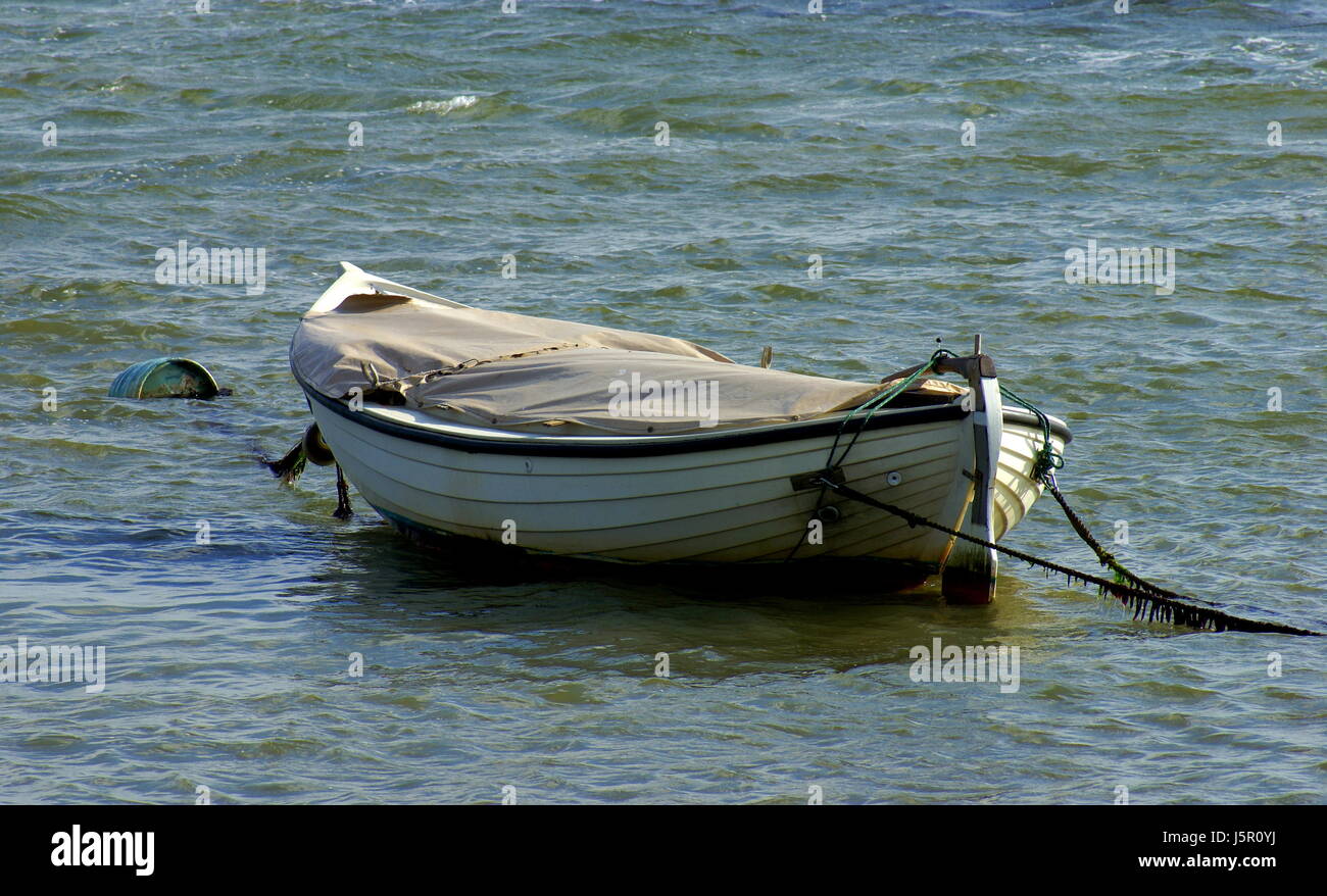 lie lying lies coast affixed rowing boat barrel held on water sailing ...