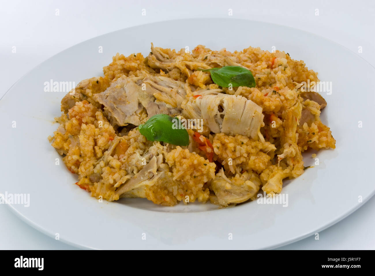 risotto with fried chicken Stock Photo - Alamy