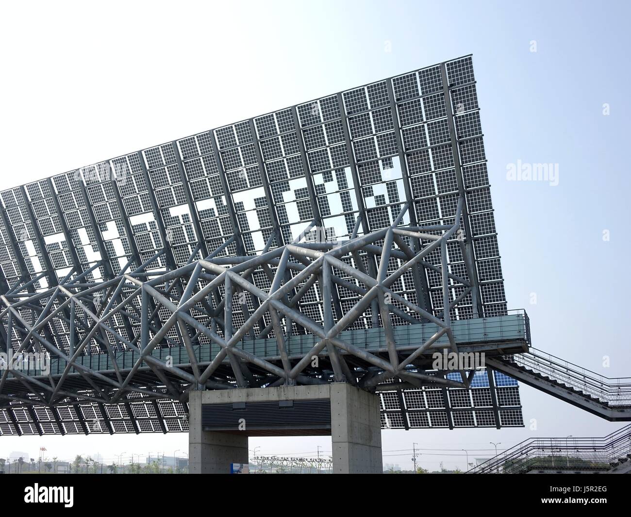 TAINAN, TAIWAN -- MARCH 4, 2014: A giant wall of solar panels is a ...