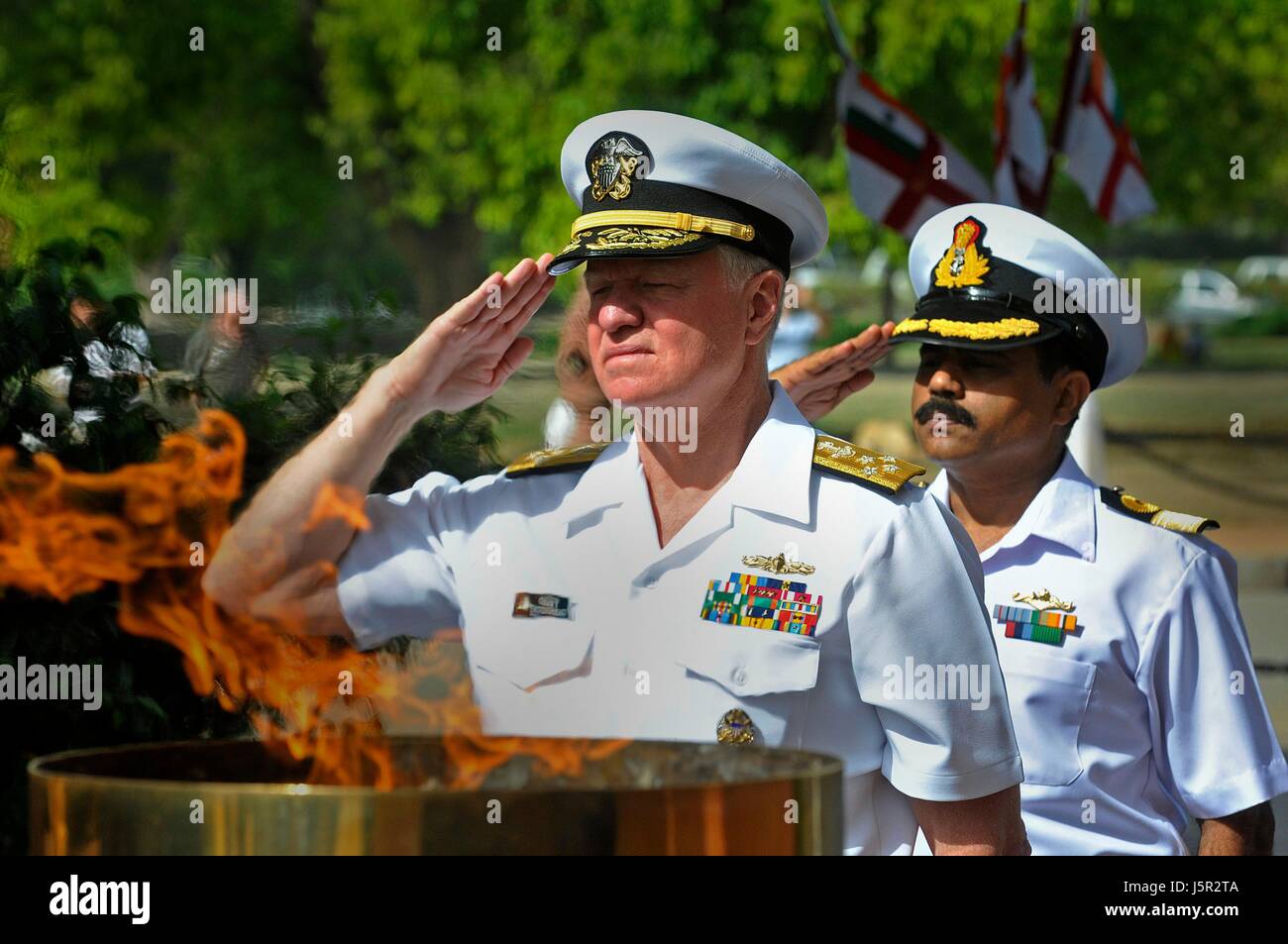 U.S. Chief of Naval Operations Gary Roughead renders honors during a ...