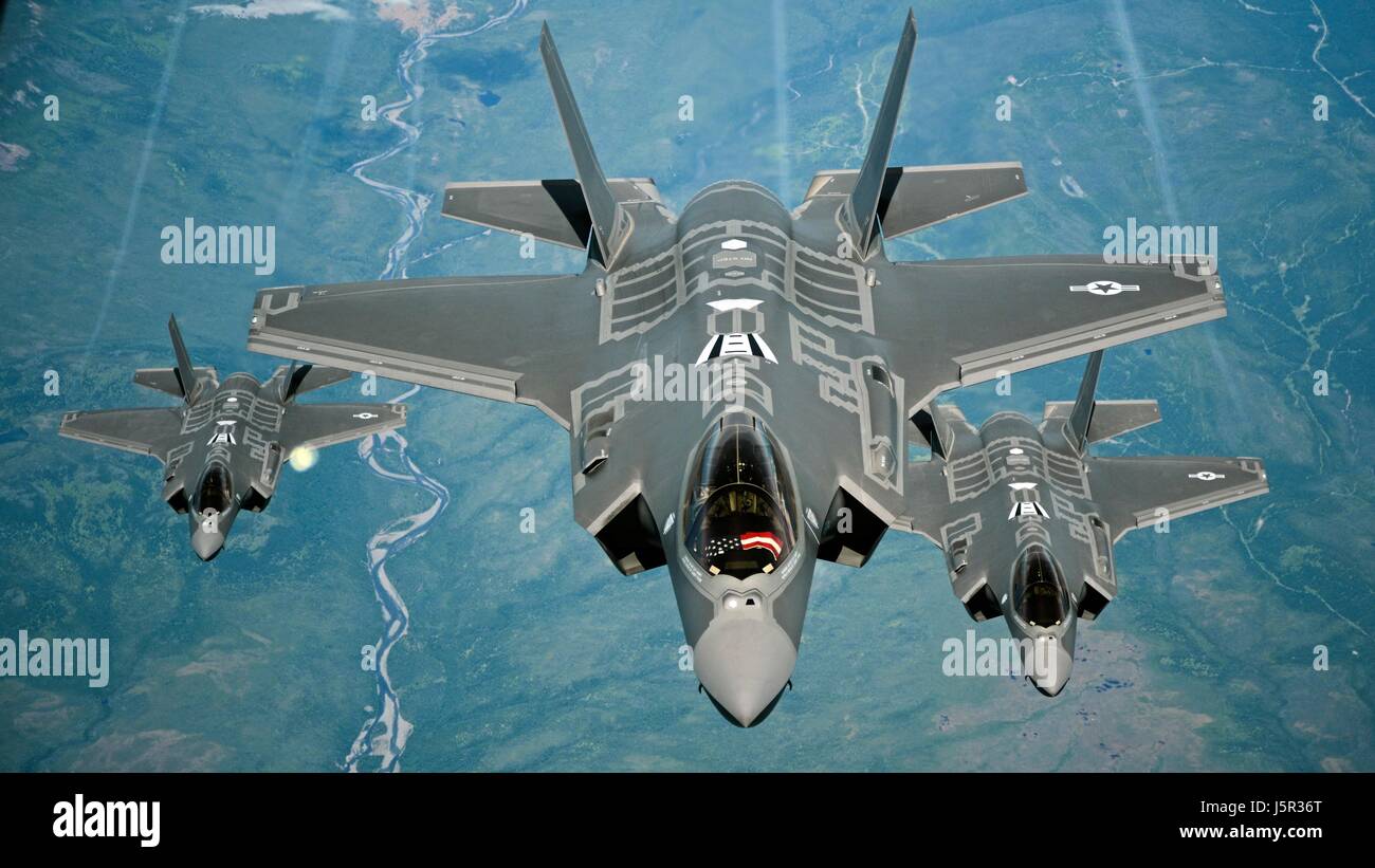 USAF F-35A Lightning II stealth fighter aircraft fly in formation over the Travis Air Force Base ...