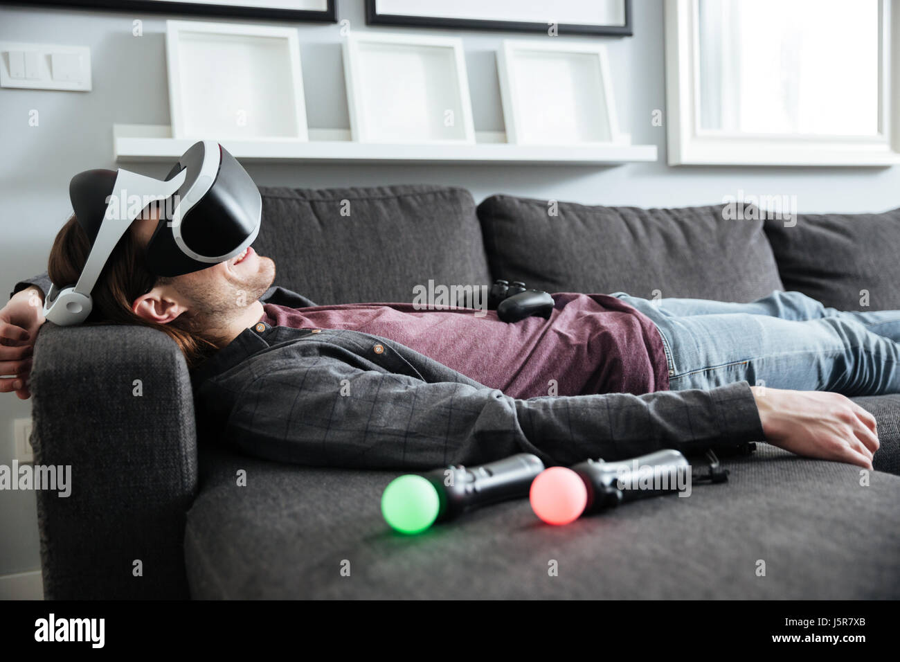 Vr gamer on sofa hi-res stock photography and images - Alamy